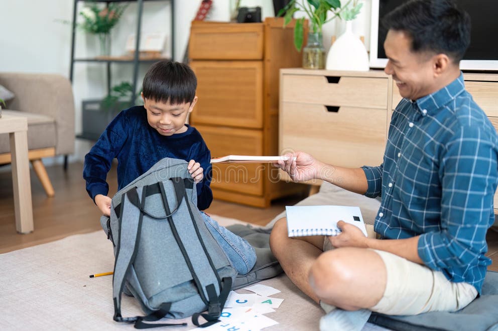 Father and Son Preparing for School with Joyful Interactions Stock ...