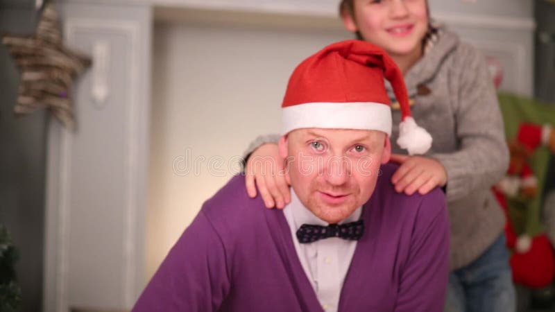 Father with Son in Red Santa Caps Pose Near Big Stock Footage - Video ...