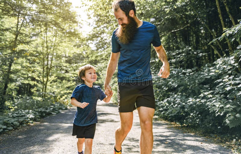 Father and Son Running Outside in Forest Stock Image - Image of healthy ...