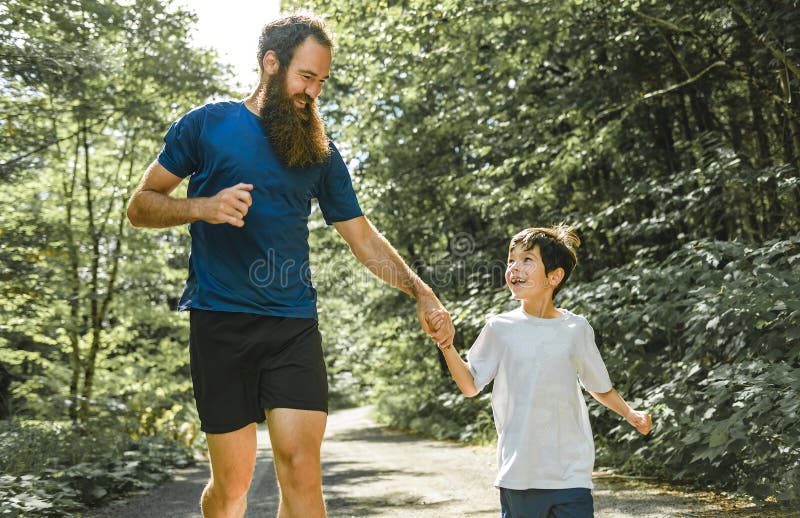 Father and Son Running Outside in Forest Stock Photo - Image of fitness ...