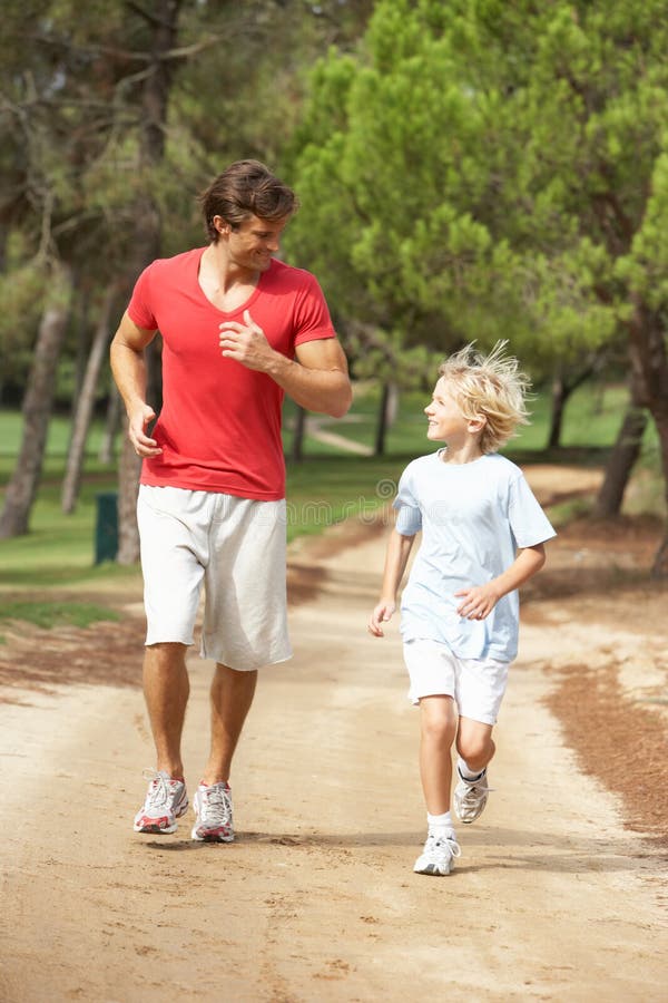 Father and Son Running in Park Stock Photo - Image of lifestyle ...