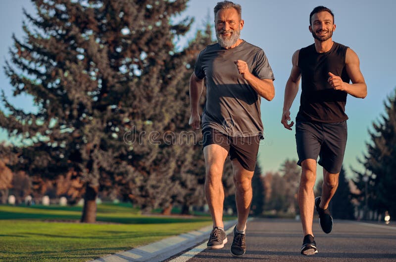 The Father and Son Running on the Road. Stock Photo - Image of athletic ...