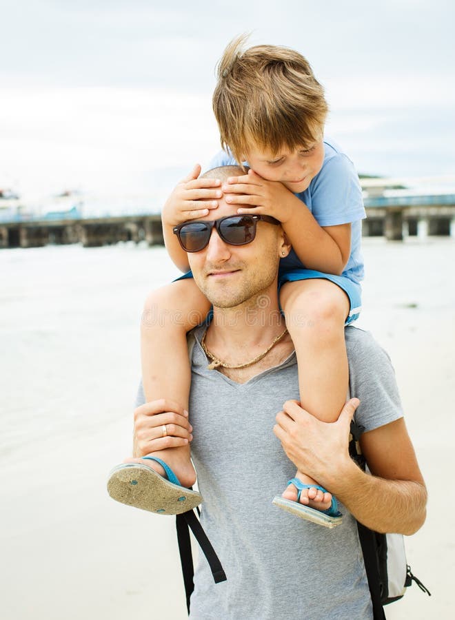 Father and son on the sea stock photo. Image of happiness - 59281250