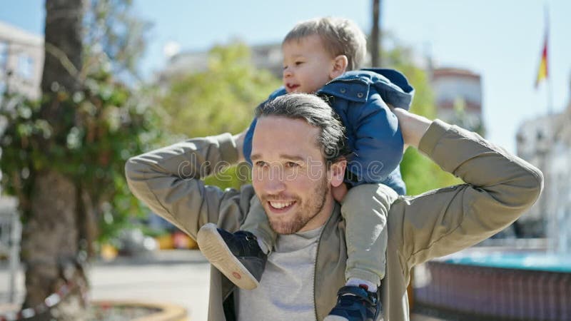 Father and Son Smiling Confident at Park Stock Footage - Video of ...