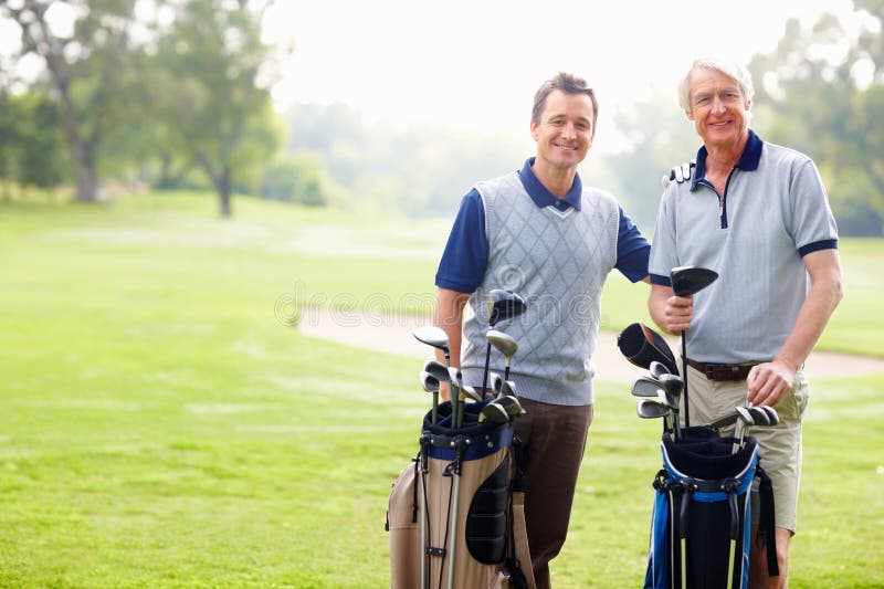 Father and Son Smiling on Golf Course. Portrait of Father and Son ...