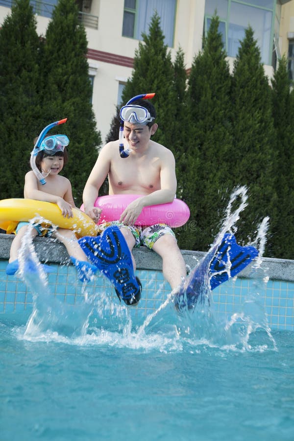 Boy in pool splashing stock image. Image of aound, year - 94811839