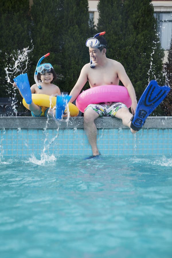 Boy in pool splashing stock image. Image of aound, year - 94811839