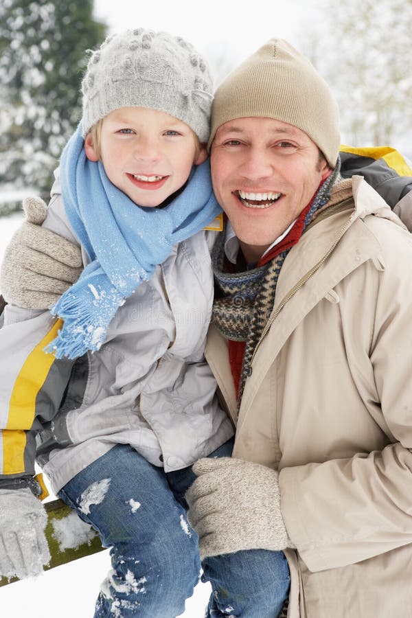 Father and Son Standing Outside in Snow Stock Photo - Image of loving ...