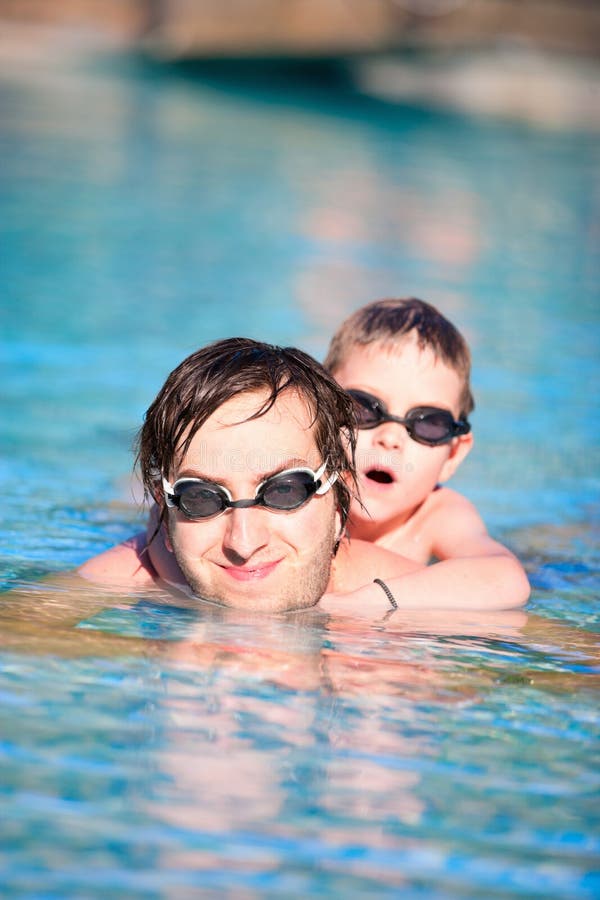 Father and Baby in a Swimming Pool Stock Photo - Image of family ...