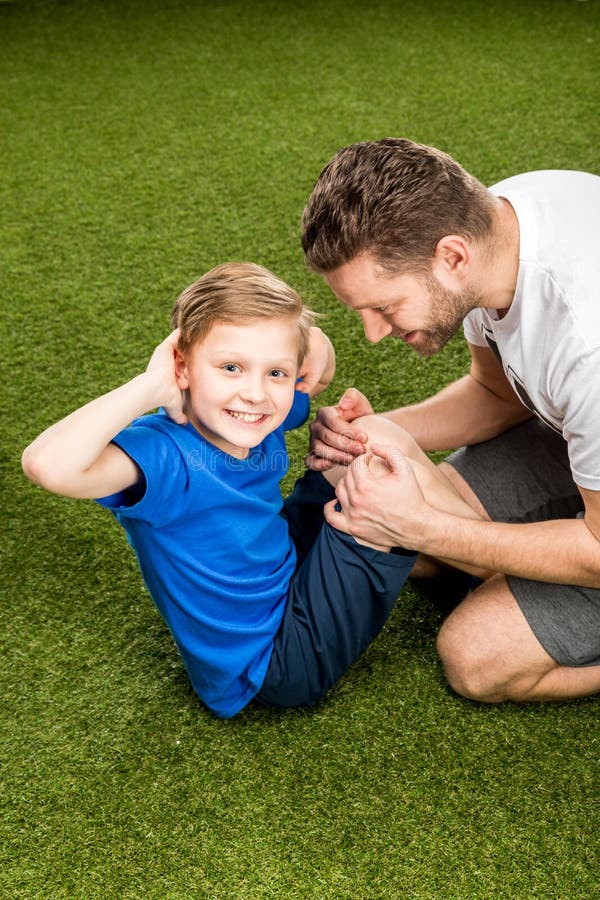 Father and Son Training Together on Grass Stock Image - Image of daddy ...