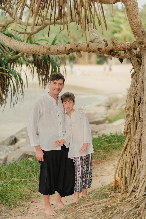 Father and Son Under a Tree in the Indian Pants Stock Photo - Image of ...