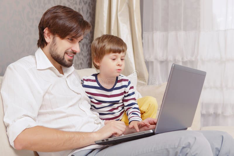 Father and Son Use Computer Stock Photo - Image of closeup, lifestyle ...