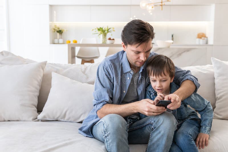 Father and Son Use a Smartphone Stock Image - Image of internet, family ...