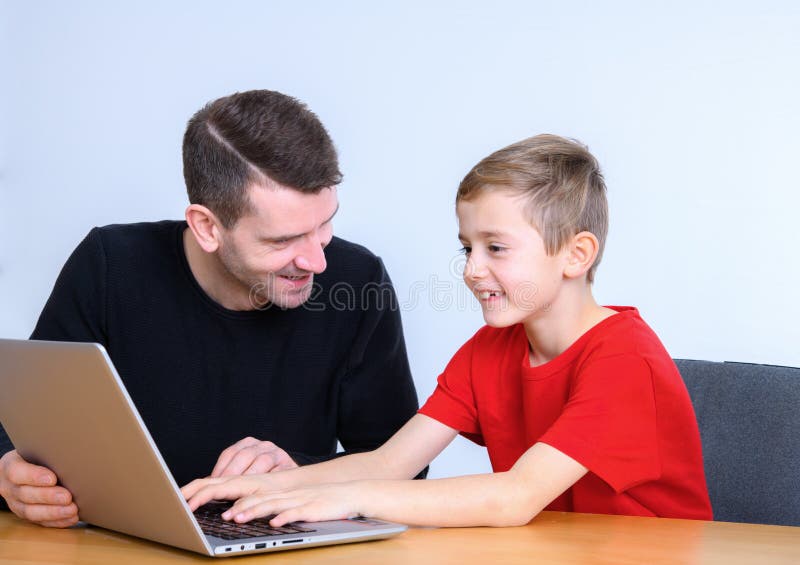 Father and Son Using Computer Together Stock Image - Image of sitting ... Father and Son Using Computer Together Stock Image - Image of sitting ...
