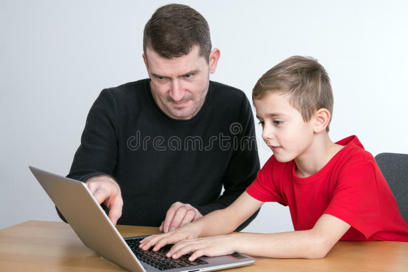 Father and Son Using Computer Together Stock Photo - Image of male ...