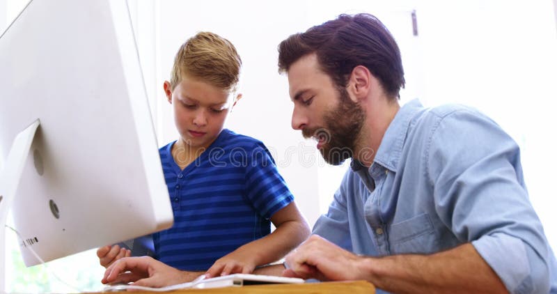 Father and Son Using Computer Together Stock Video - Video of caucasian ...