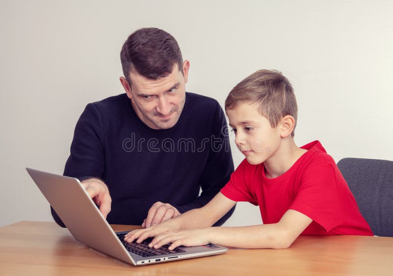 Father and Son Using Computer Together Stock Image - Image of childhood ...