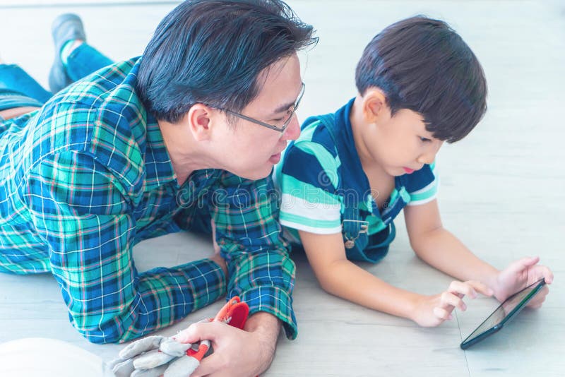 Father and Son in Using Smartphone Together for Modern Family and ...