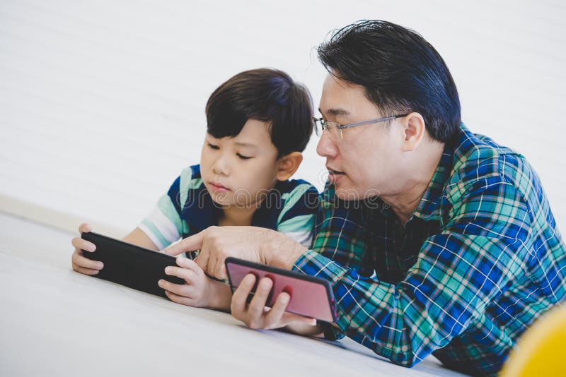 Father Son in Using the Smartphone Together for Modern Family and ...