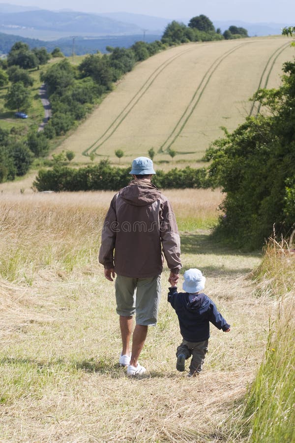 Father and son walking stock photo. Image of domestic - 19287992