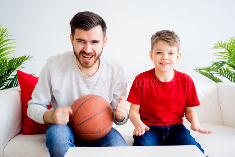 Father and Son Watching Basketball Stock Image - Image of relaxed, rest ...