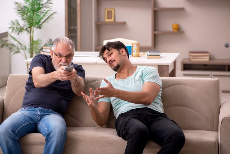 Father and Son Watching Tv during Pandemic Stock Image - Image of ...