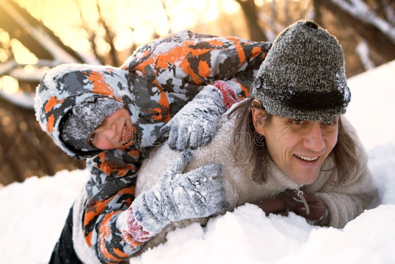 Father and Son in the Winter on a Cold Roll and Play in the Snow Stock ...