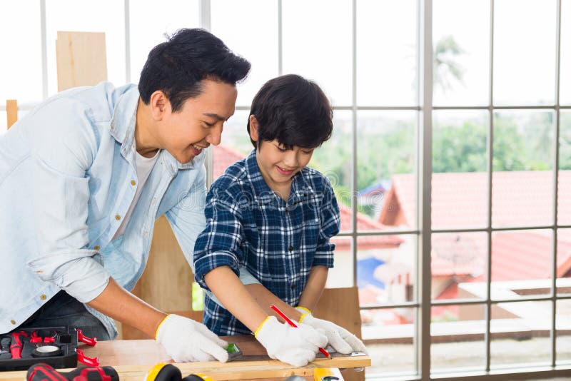 Father and Son Work Together To Do Woodwork Stock Photo - Image of ...