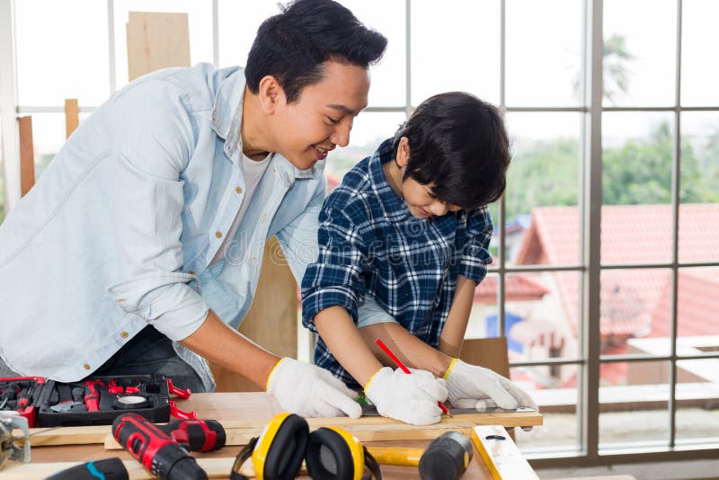 Father and Son Work Together To Do Woodwork Stock Photo - Image of ...