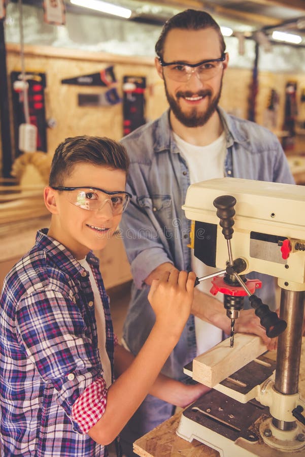 Father and Son Working with Wood Stock Image - Image of ruler ...