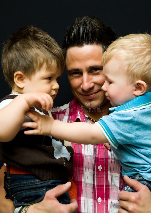 Father and sons stock image. Image of hold, child, posed - 15954795