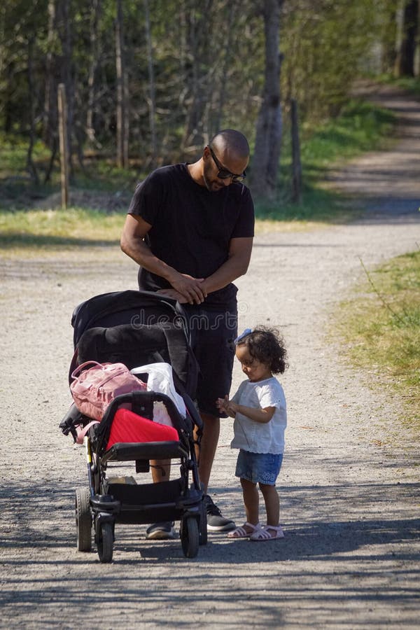 Father with Stroller Standing with Child on a Road Stock Image - Image ...