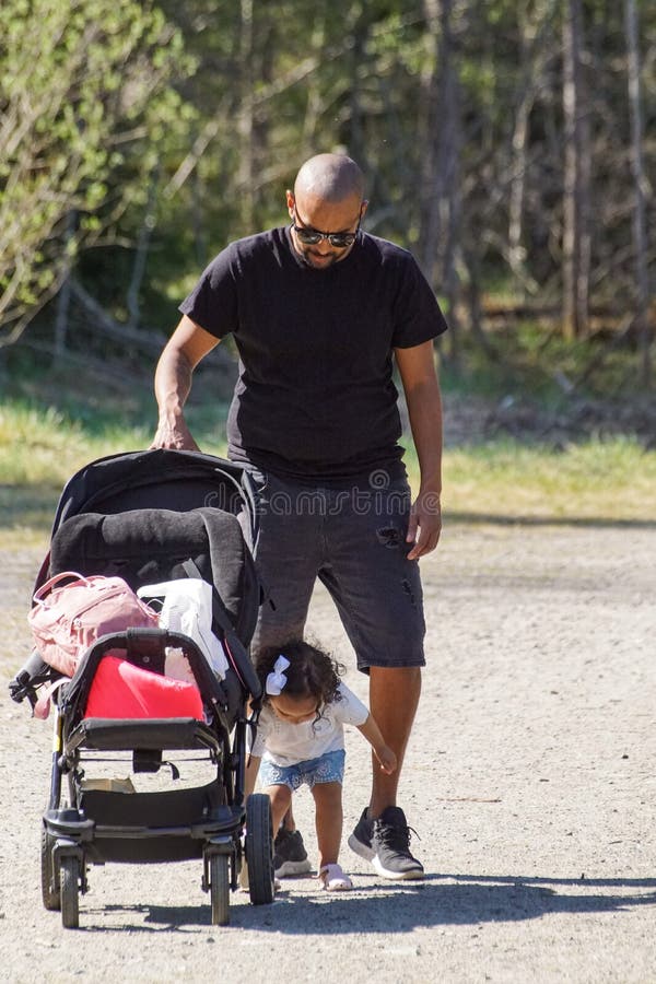Father with Stroller Standing with Child on a Road Stock Image - Image ...
