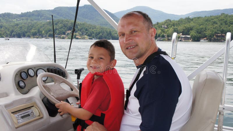 Father and son on the boat stock photo. Image of learn - 29469924