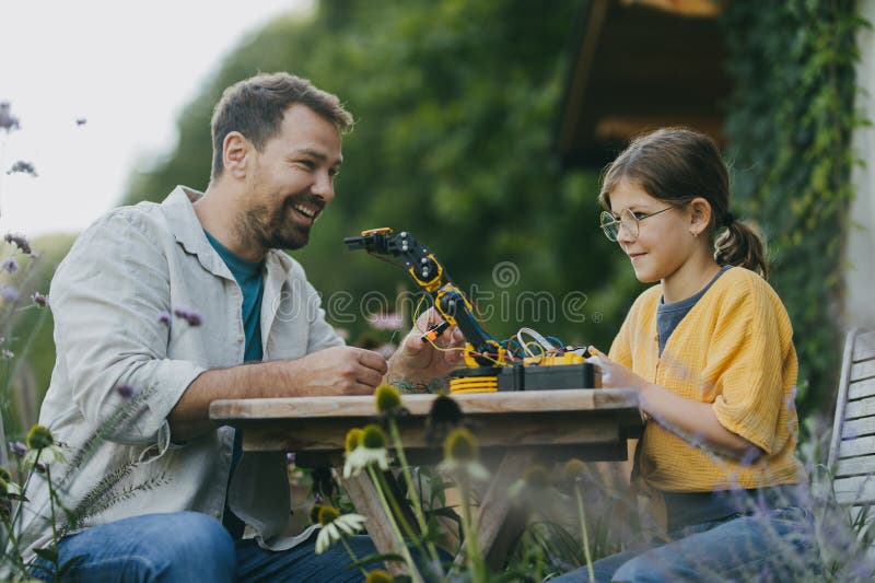 Father Supporting Daughter in Pursuing Robotics, Science, it ...