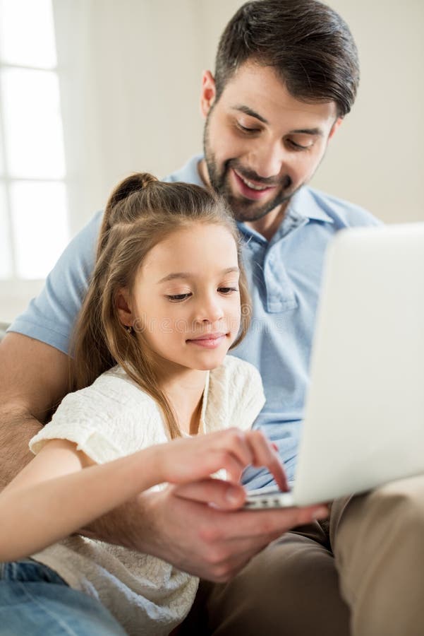 Father Teaching Daughter How To Use Laptop Stock Photo - Image of adult ...