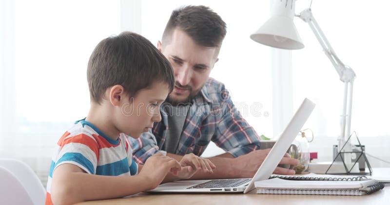 Father with Son Learning To Use Laptop Stock Footage - Video of ...