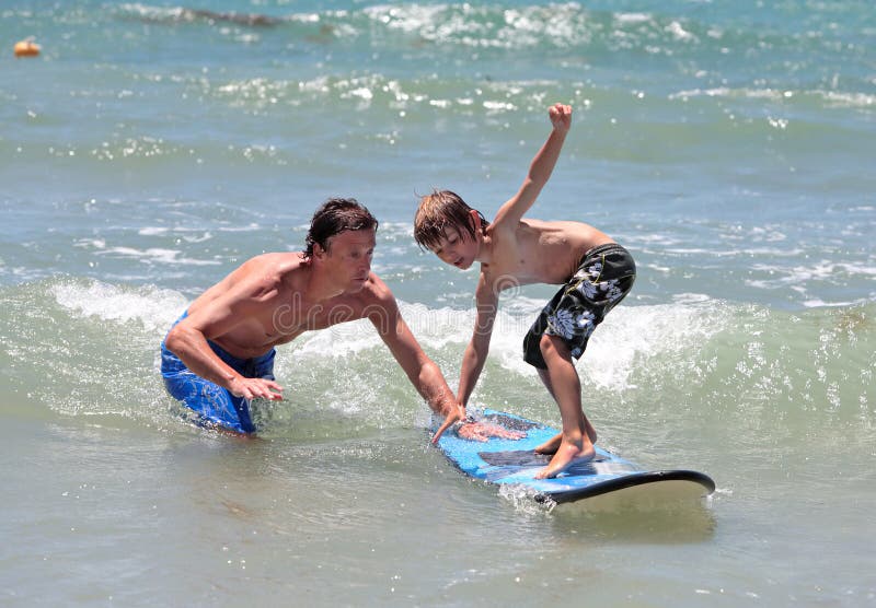 Father Teaching His Young Son To Surf Stock Image - Image of sibling ...