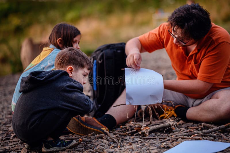 Father Teaching Kids How To Build a Small DIY Structure Stock Photo ...