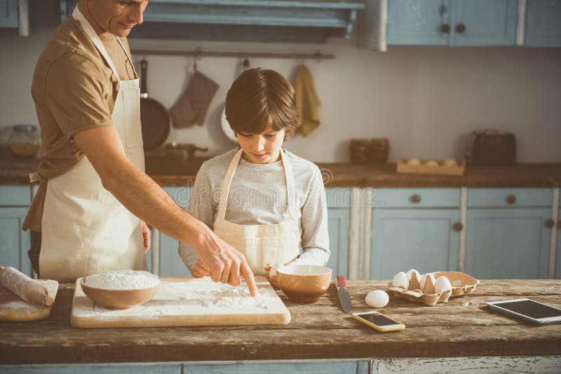 Father Teaching Son Making Cakes Stock Photo - Image of childhood ...
