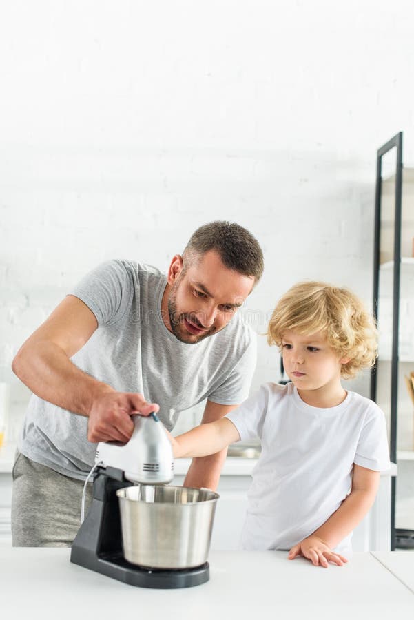 Father Teaching Son Using Mixer on Tabletop Stock Image - Image of ...