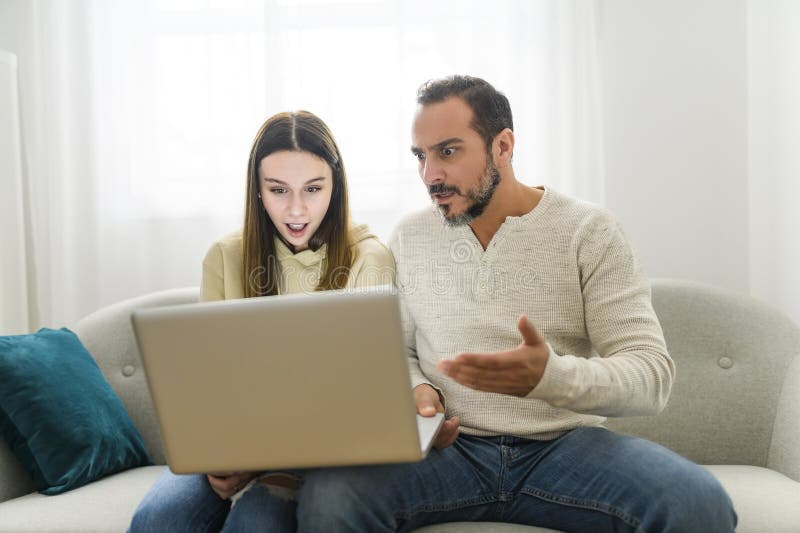 Father with Teen Child Daughter Having Fun Using Laptop Computer at ...