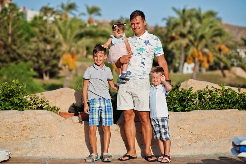 Father with Three Kids on Turkey Resort Against Palms Stock Image ...