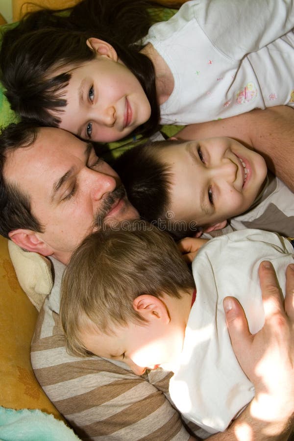 Father and Three Young Sons Stock Image - Image of loving, hugging: 2053791