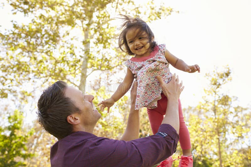 Father throwing baby boy stock photo. Image of parenthood - 28810480