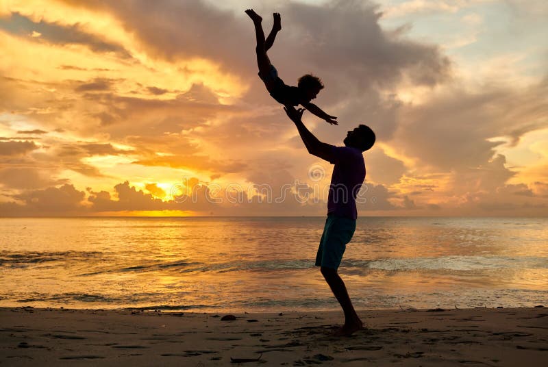 Father Throws Up Son in the Air on Beach at Sunset Stock Image - Image ... Father Throws Up Son in the Air on Beach at Sunset Stock Image - Image ...