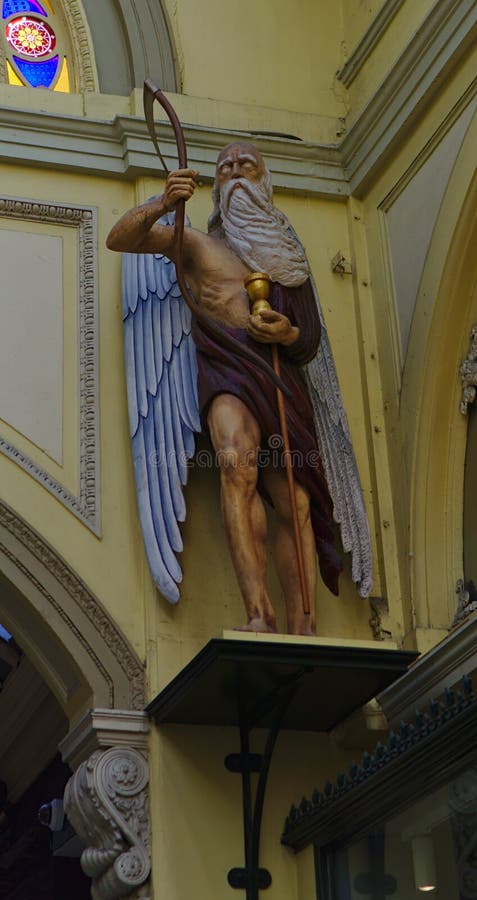 Father Time Cronus Statue in Front of Yellow Wall Editorial Stock Photo ...