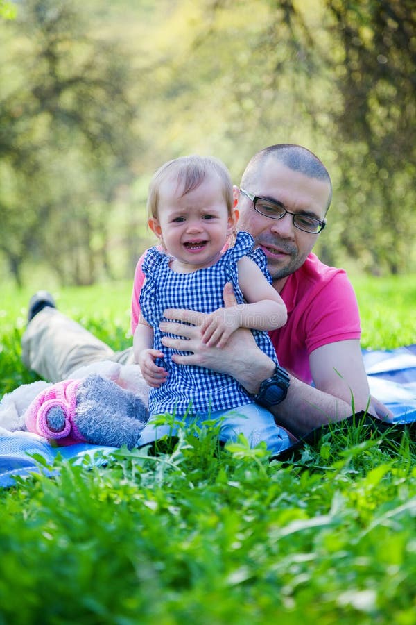 Father Trying To Calm Down His Crying Daughter Stock Image - Image of ...