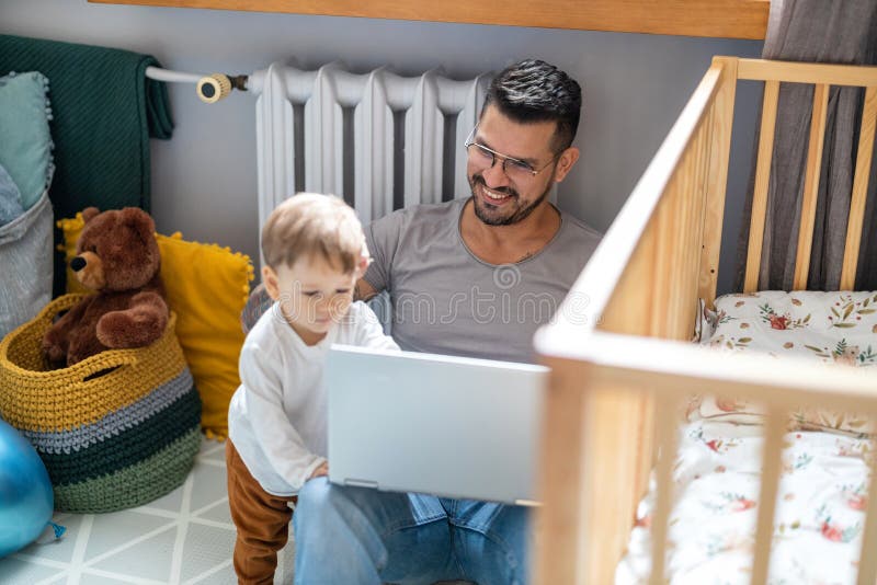 Father Trying To Work from Home with His Son Stock Photo - Image of ...