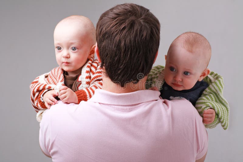 Father with two baby stock photo. Image of love, father - 9450478